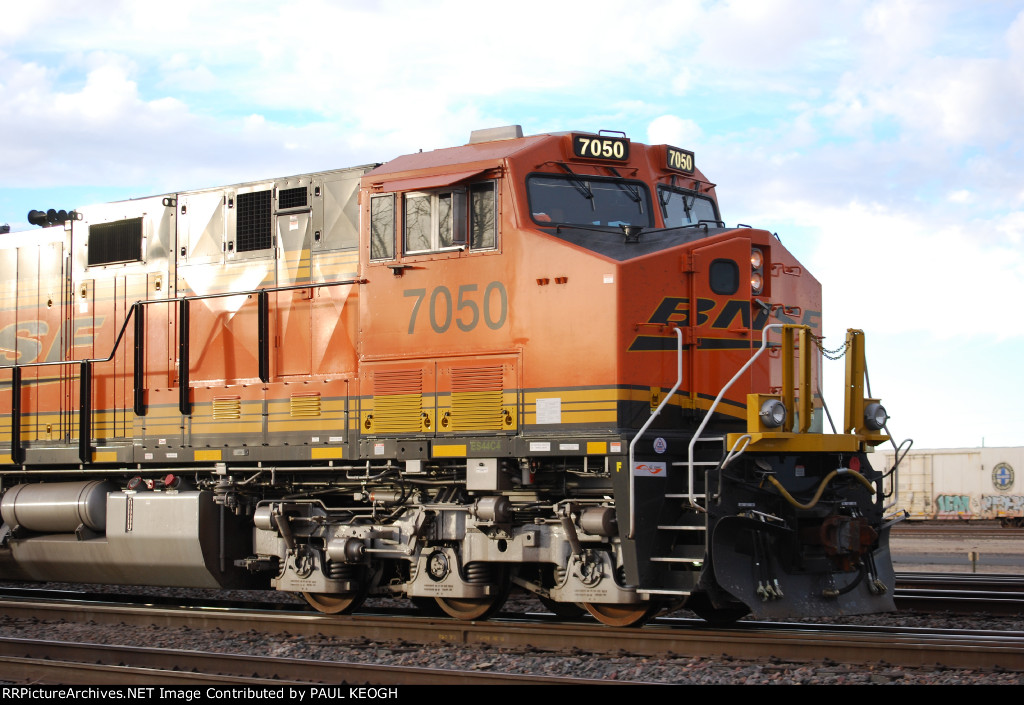 Close in Cab shot of BNSF 7050 as the setting sun shines off Her BNSF Swoosh Logo Paint.